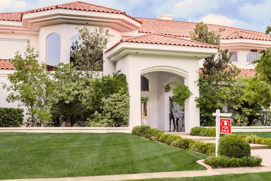 Large Red Hip Roof Stucco House